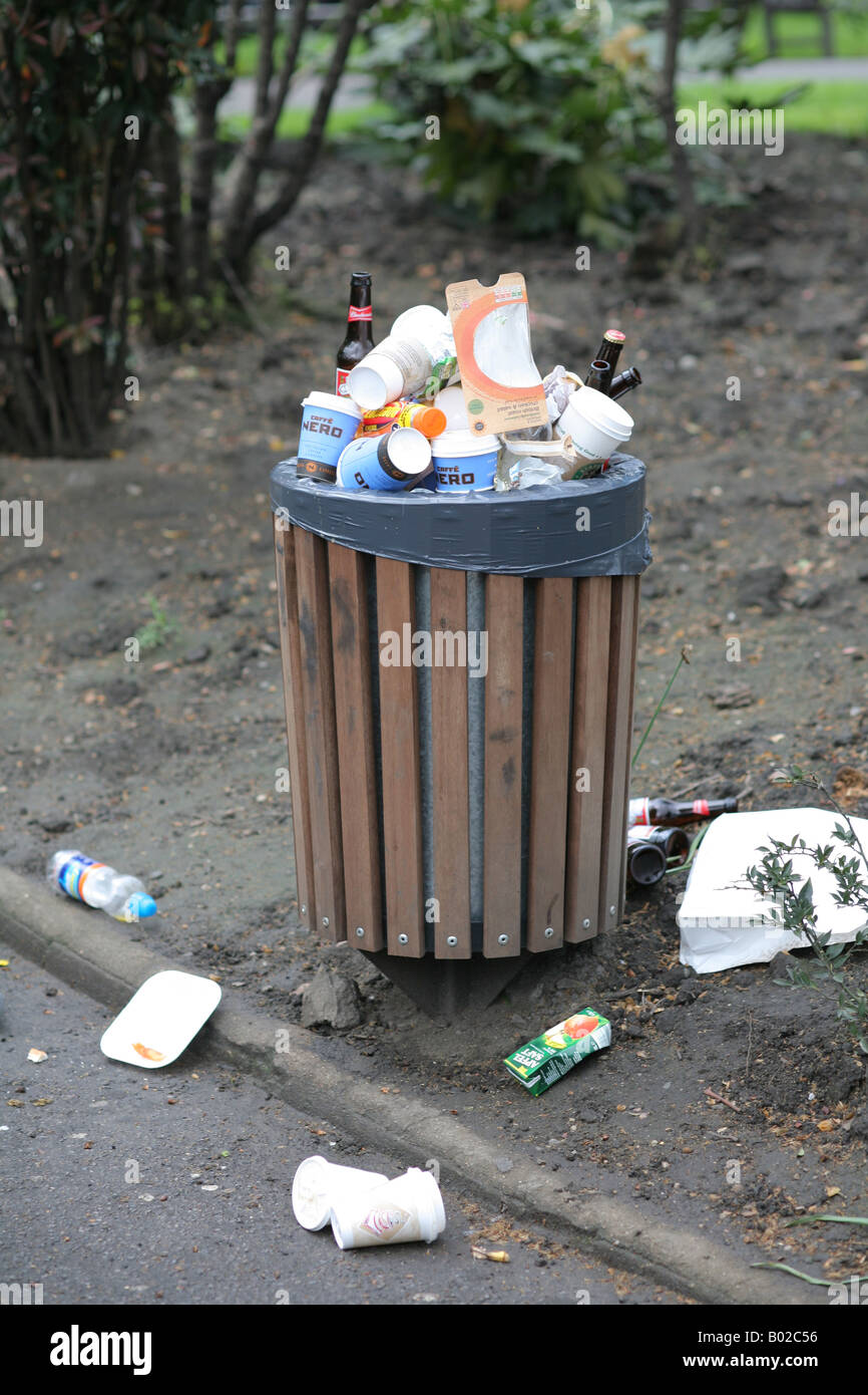 overfilled rubbish or trash bin Stock Photo - Alamy