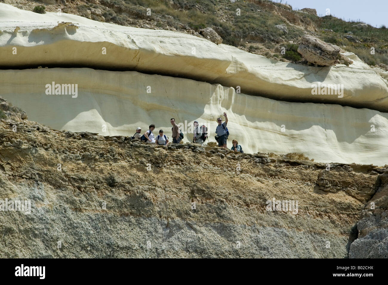 People walking on the cliffs between Dingli Cliffs and Golden Bay ...