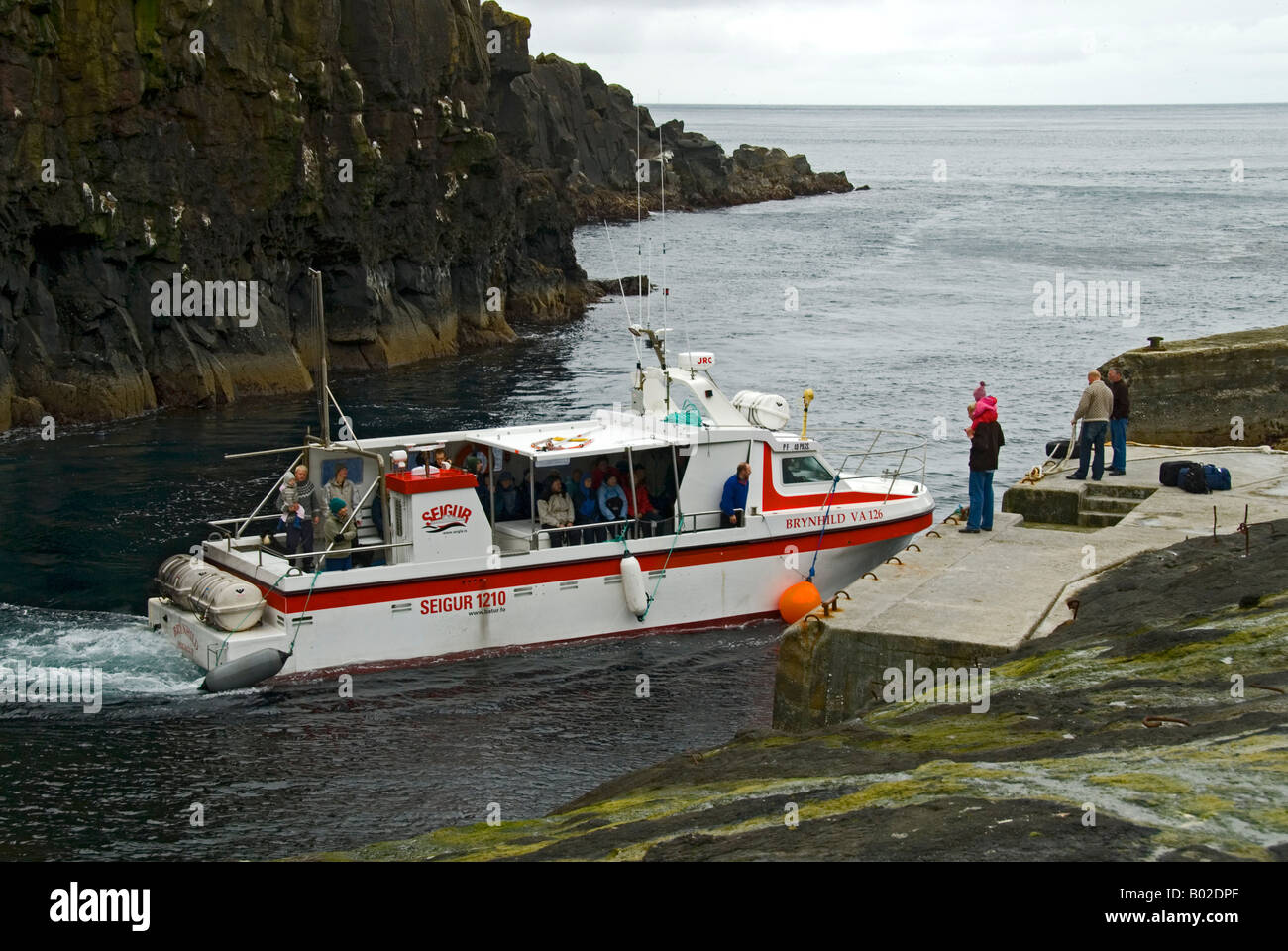 The passenger ferry arriving at Mykines Island, Faroe Islands Stock ...