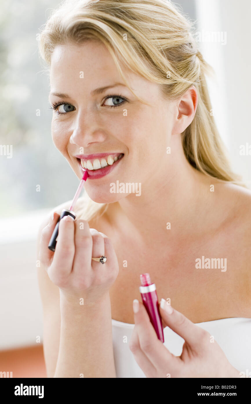 Woman apply lipstick hi-res stock photography and images - Alamy