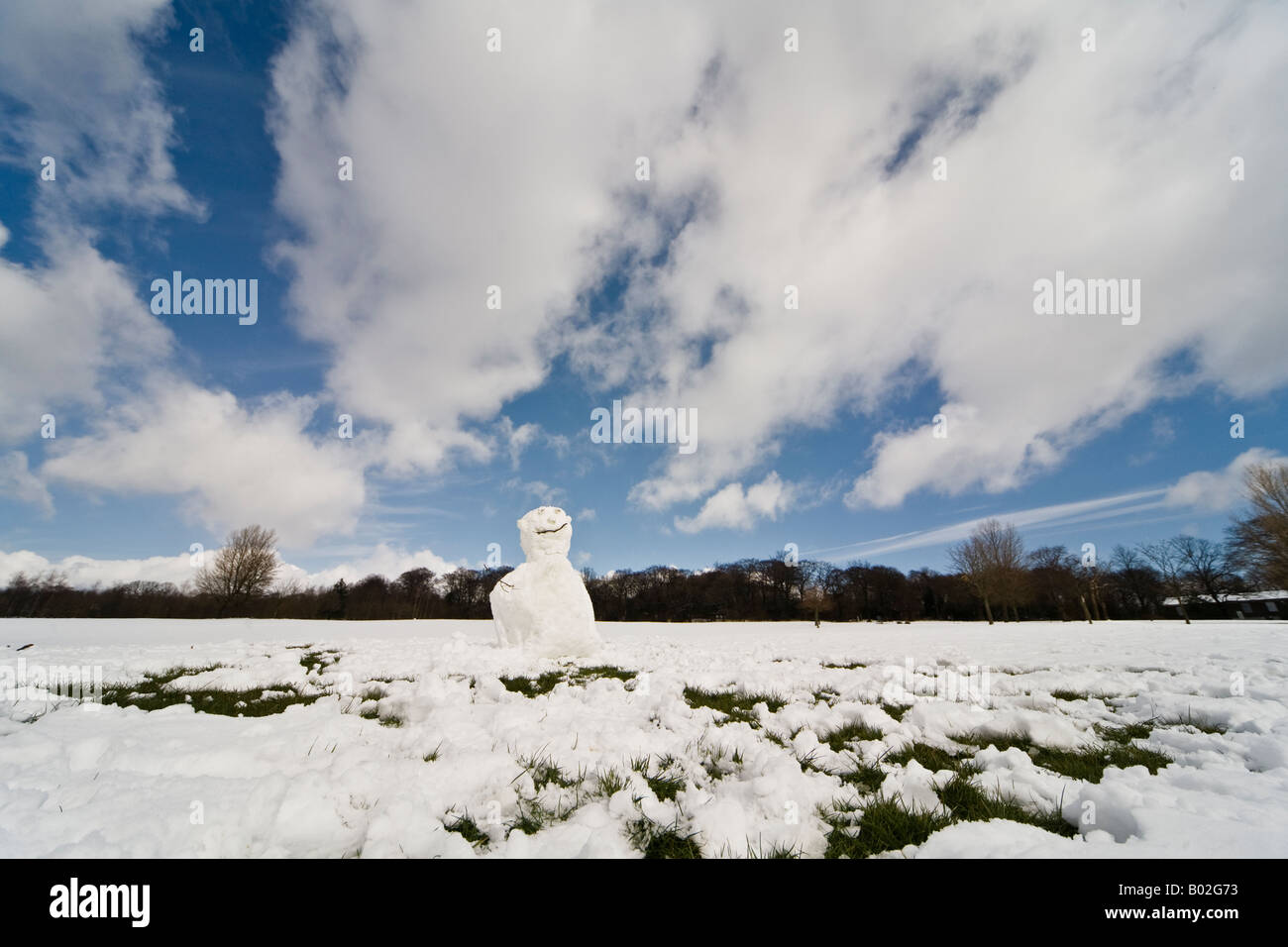 Snowman in a field full of snow wide angle Chesham nature reserve Bury ...