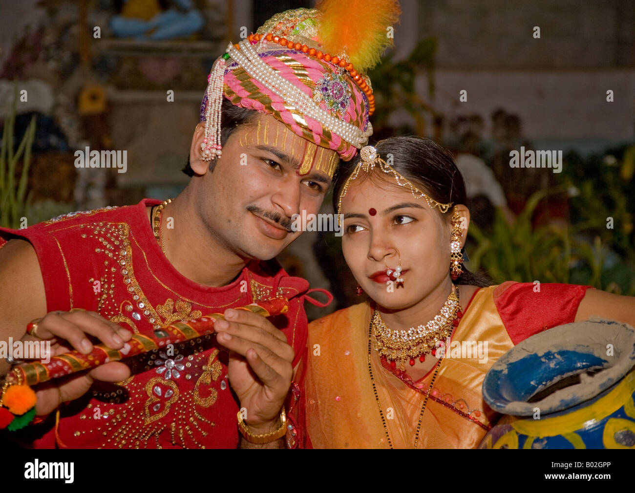 A newly wed young couple in traditional exquisite marriage clothing ...