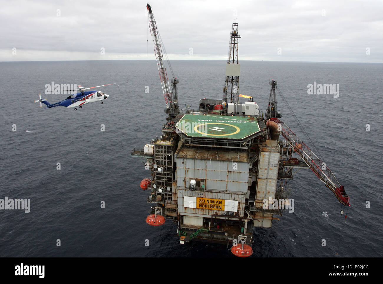 A Bristows S-92 helicopter lands on an oil rig in the North Sea off the ...
