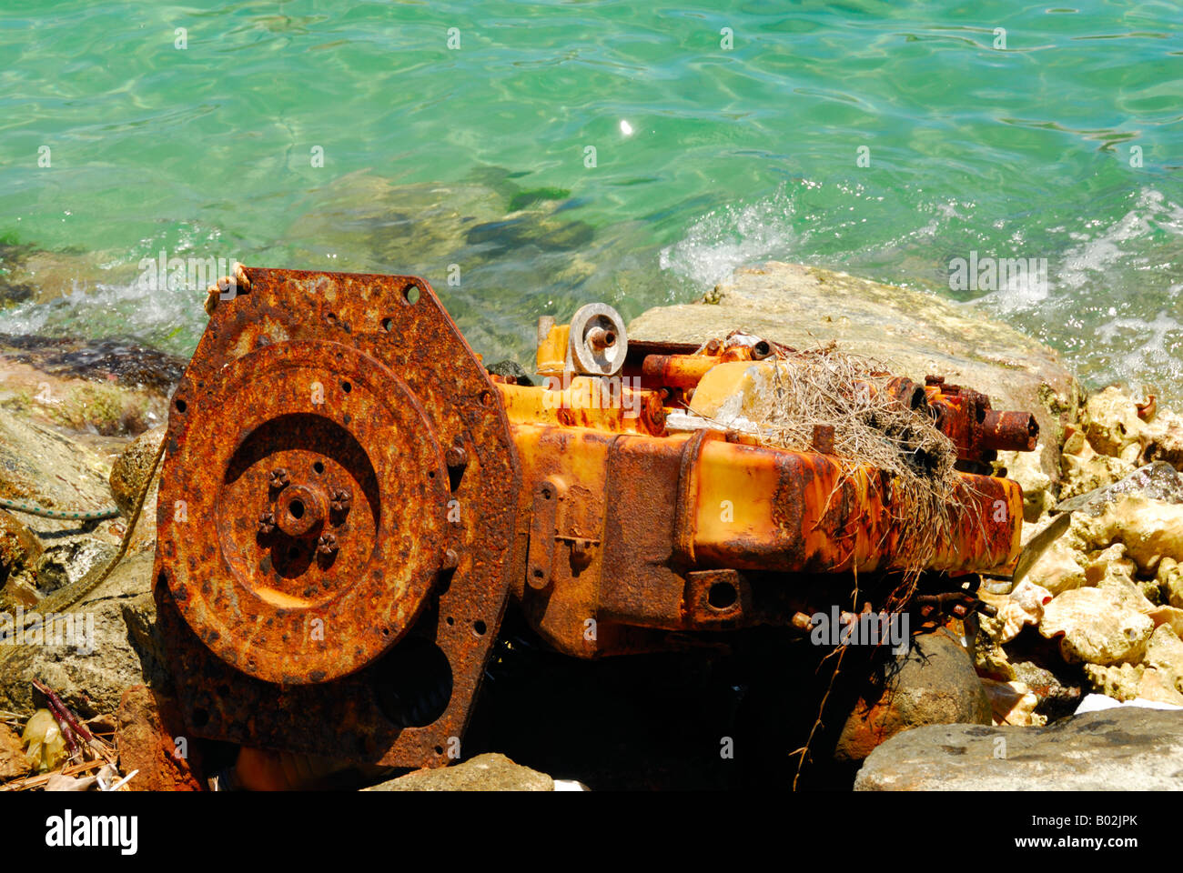 Rusty engine washed up on a beach Stock Photo - Alamy