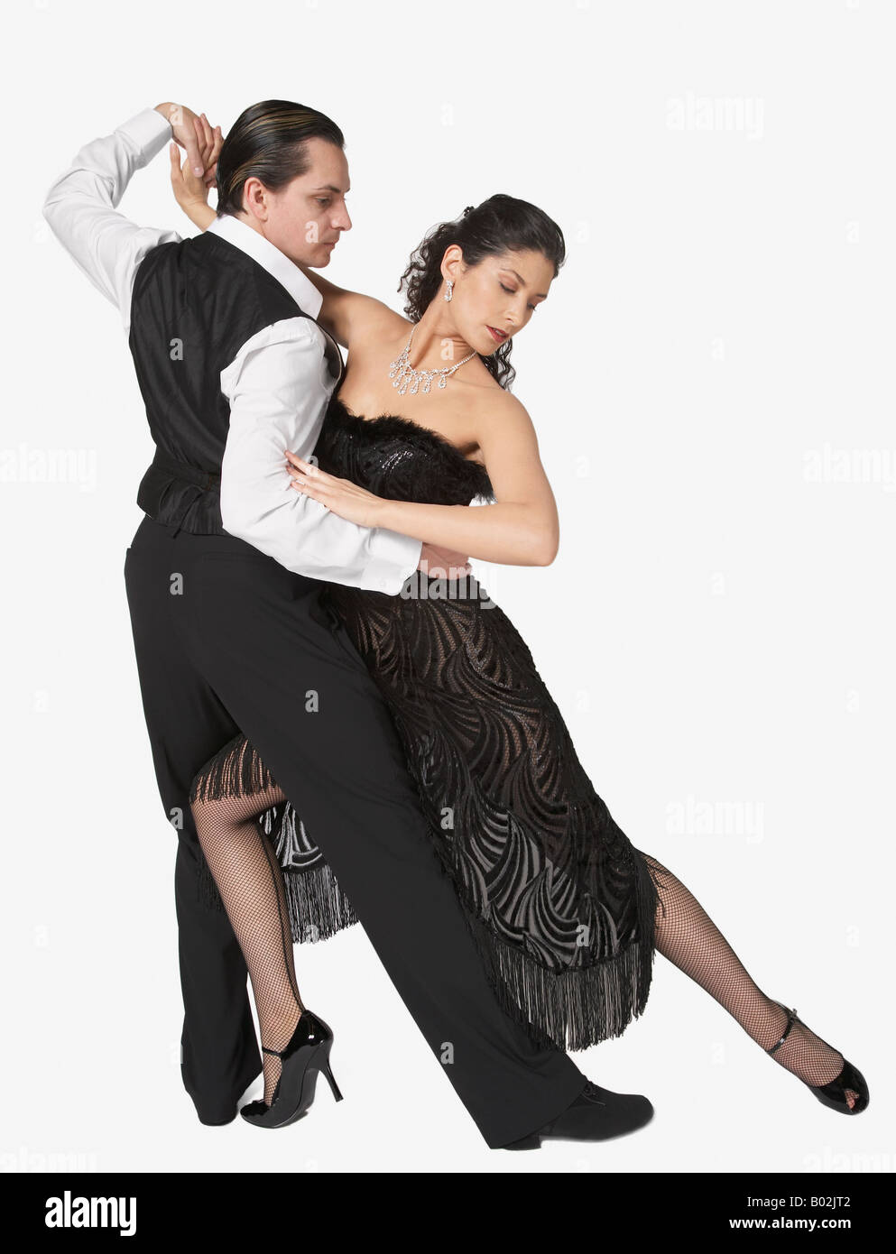 Multi-ethnic couple tango dancing Stock Photo - Alamy