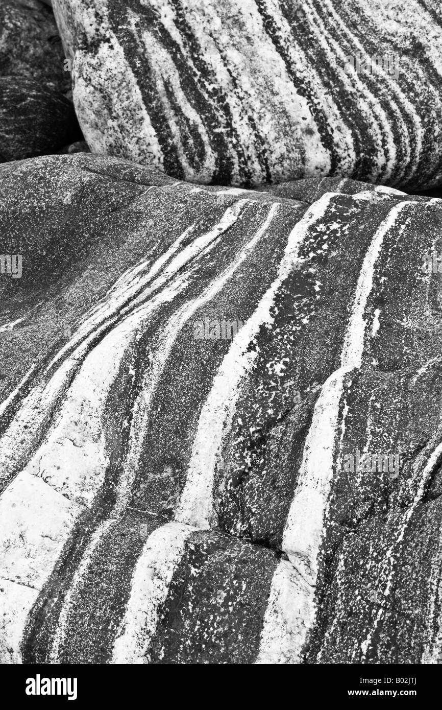 Curved rock forms composed of quartz and granite on the western coast ...