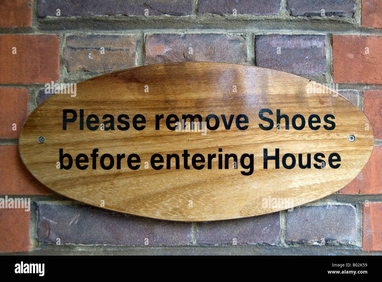sign asking for shoes to be removed before entering a building Stock ...