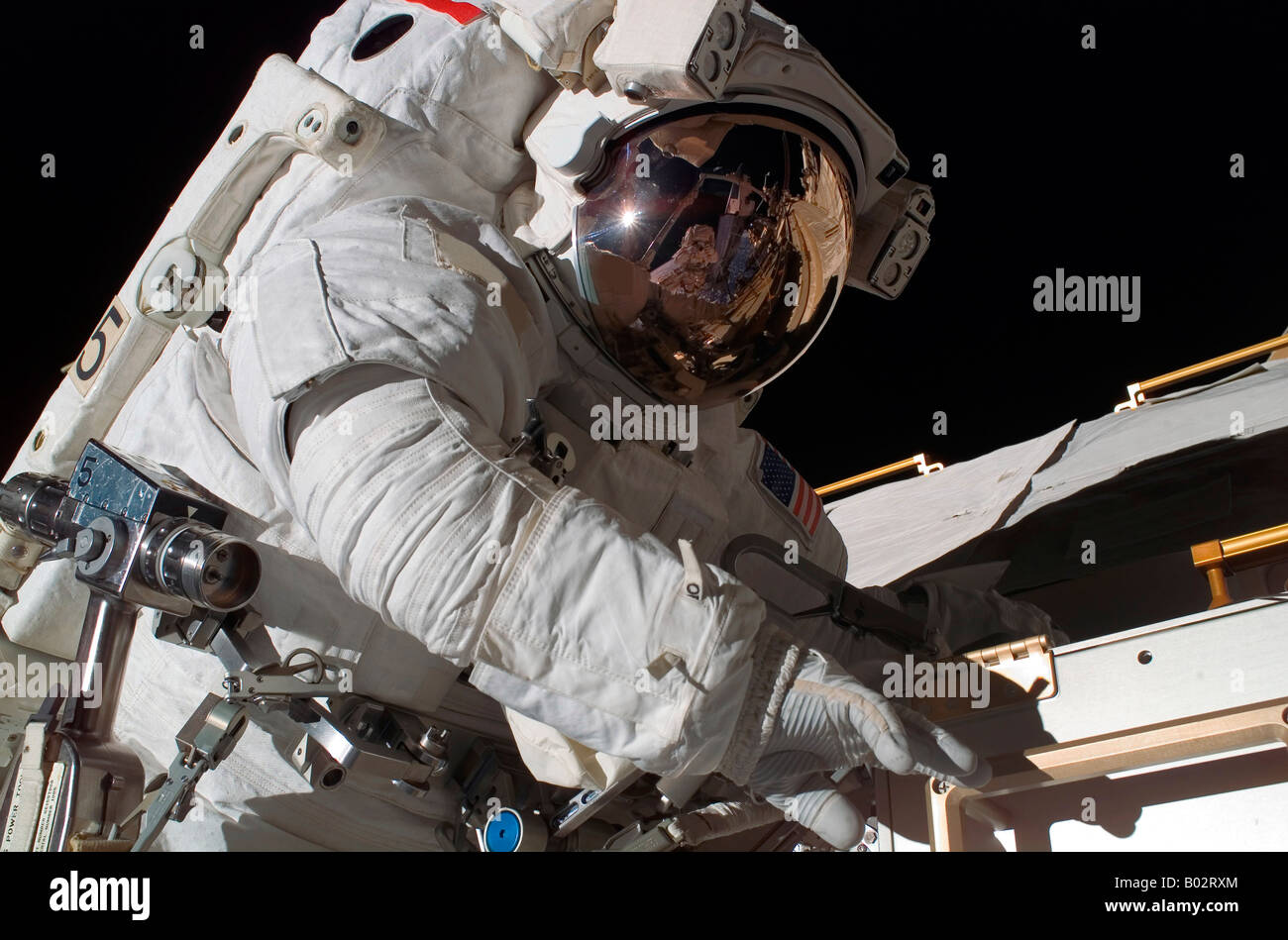 Astronaut participating in extravehicular activity Stock Photo - Alamy