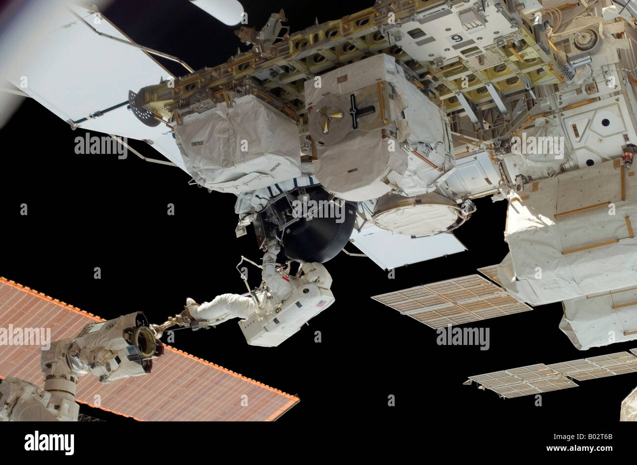 Astronaut participating in extravehicular activity Stock Photo - Alamy