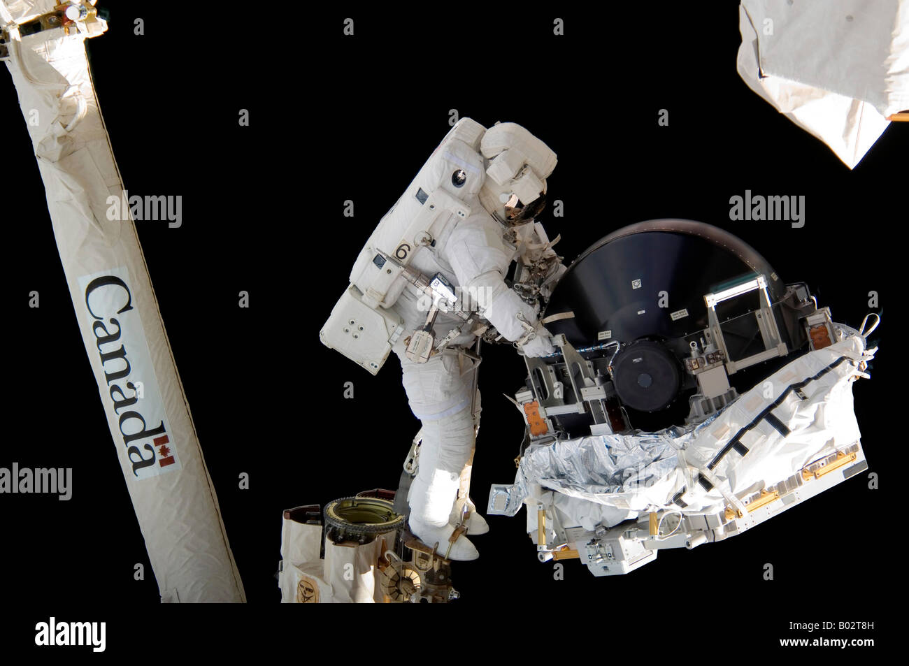 Astronaut partcipating in extravehicular activity Stock Photo - Alamy