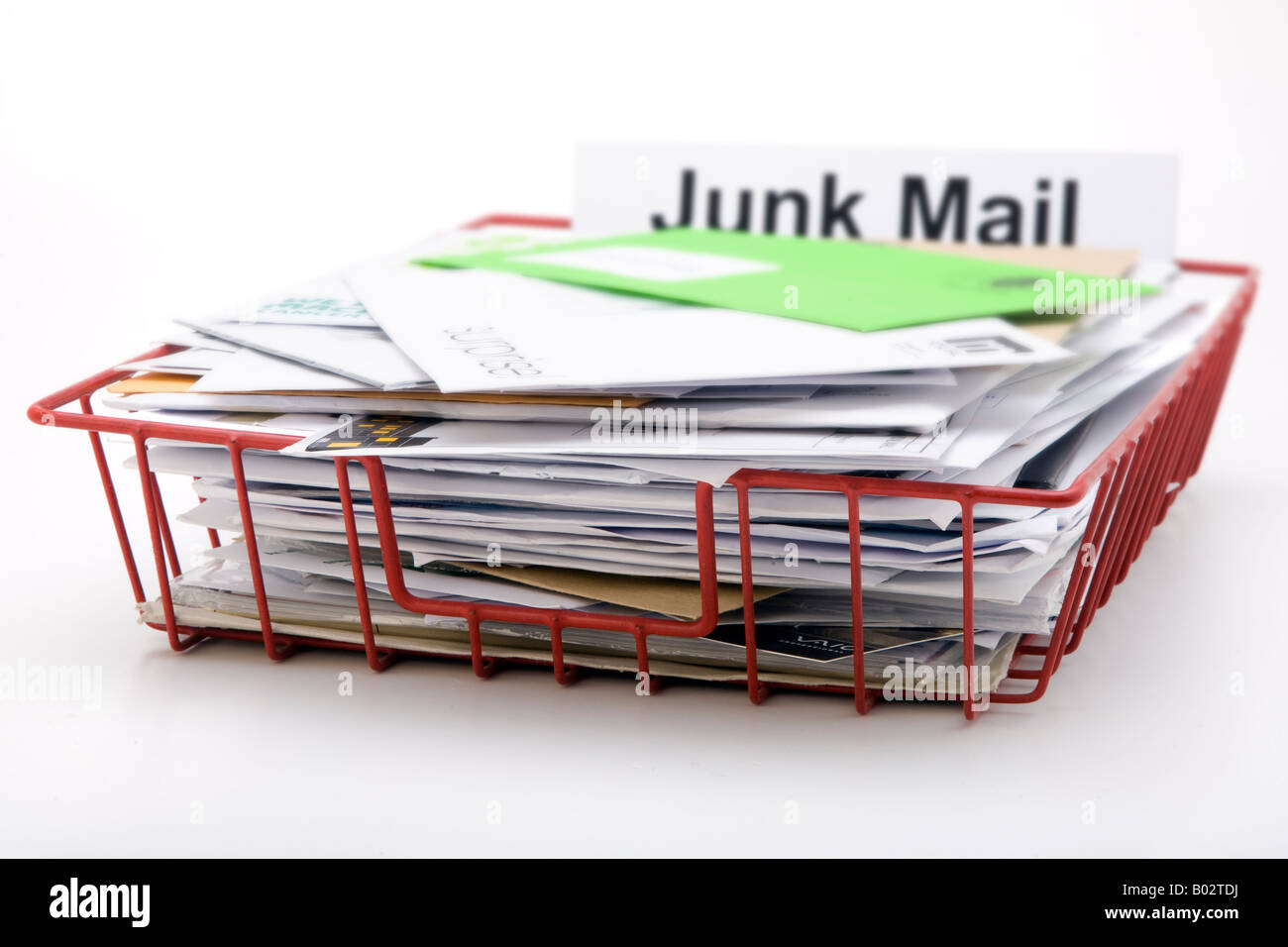 red wire mesh office post tray full of junk mail Stock Photo - Alamy