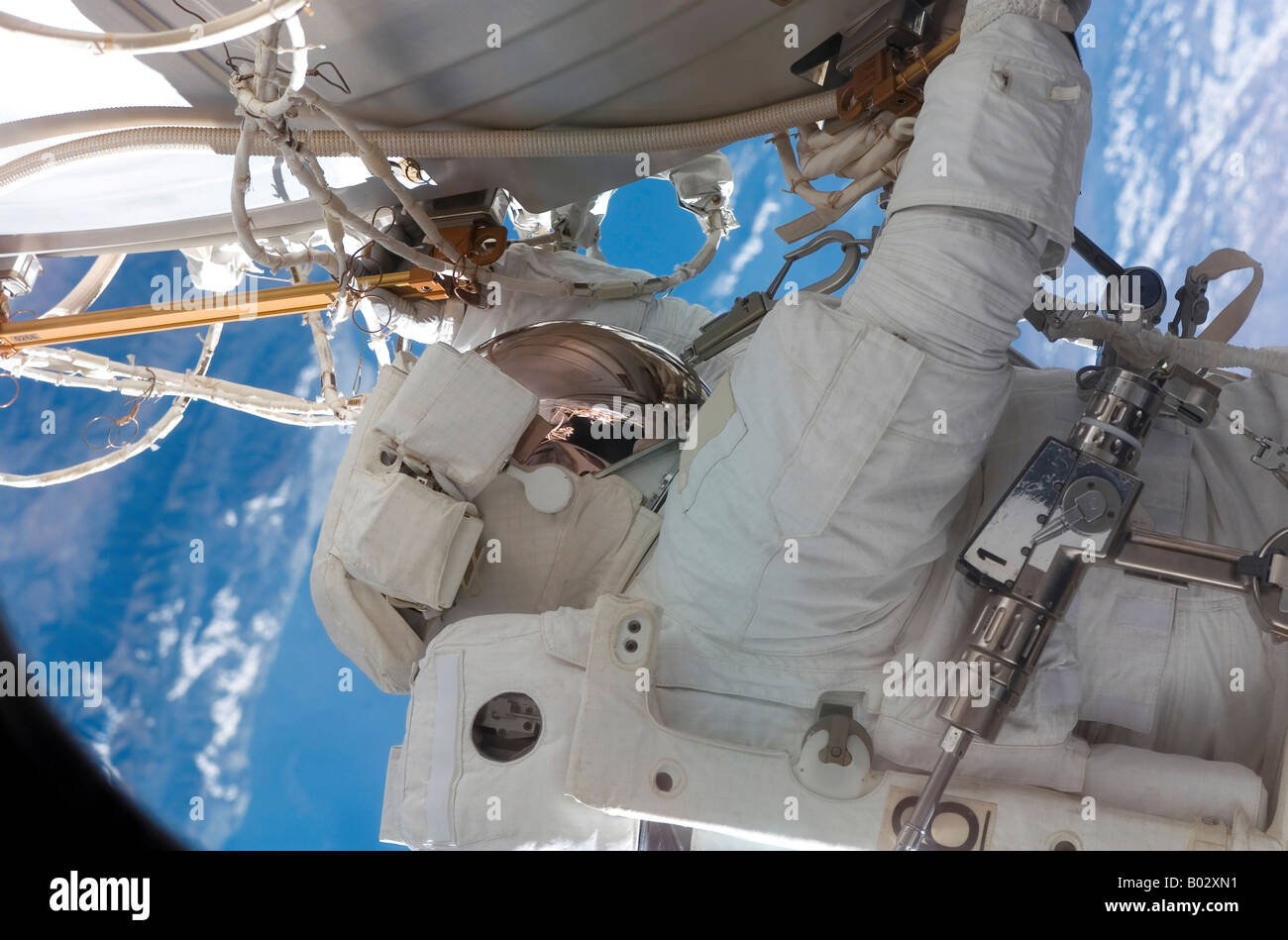Astronaut participating in extravehicular activity Stock Photo - Alamy