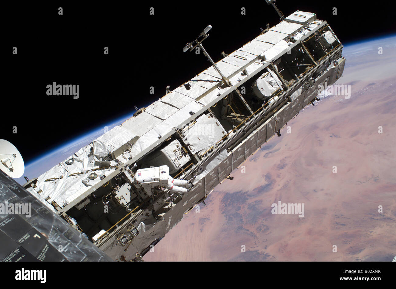 Astronaut participating in extravehicular activity Stock Photo - Alamy