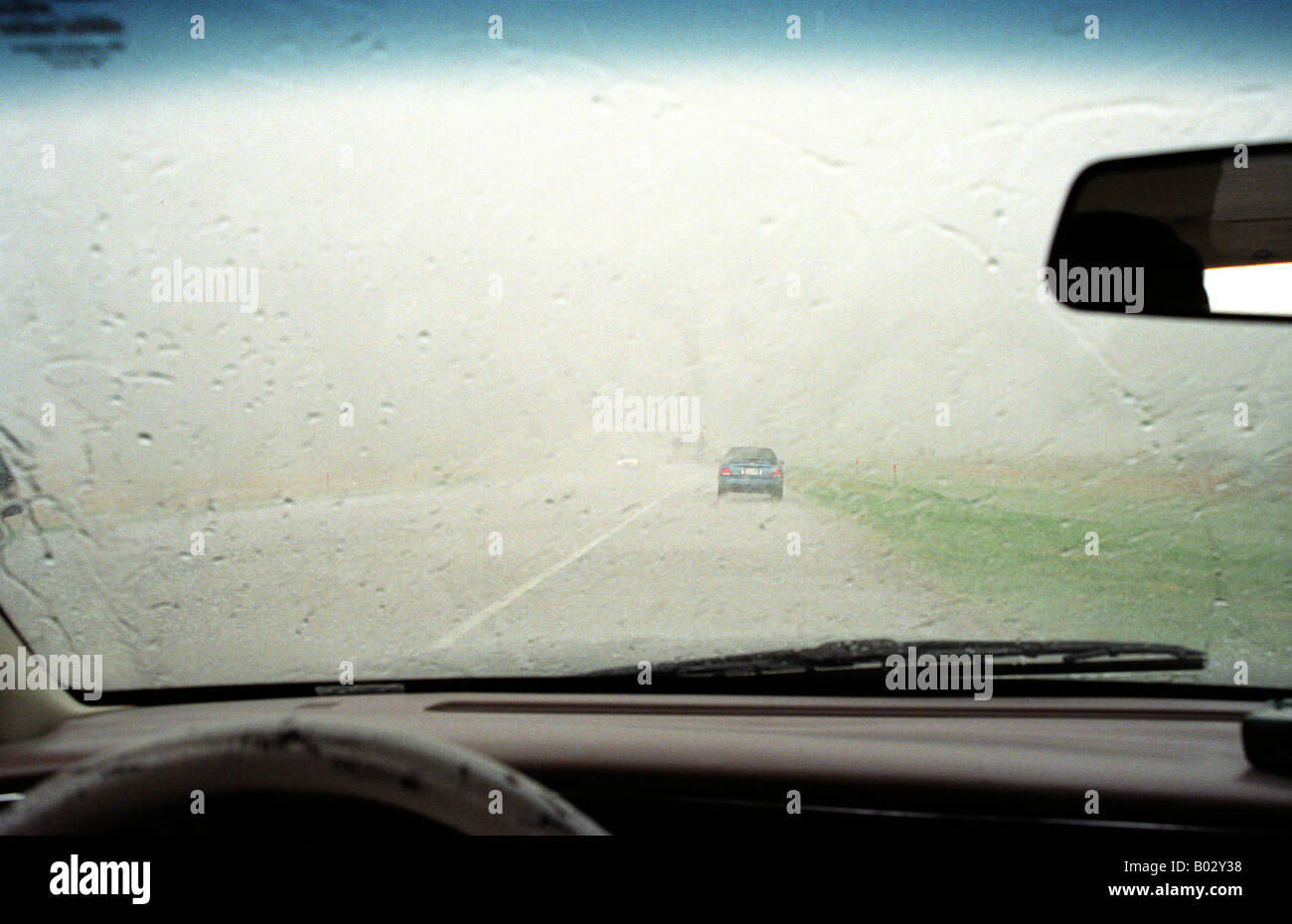 Driving through a thunderstorm in rural Kansas, April 15, 2005. Car is ...