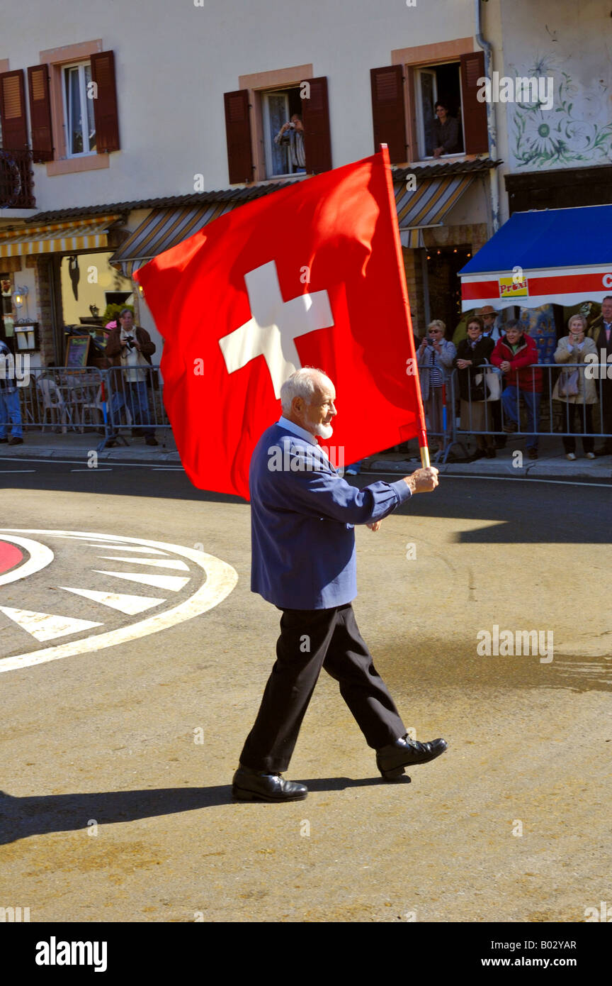 A Swiss flag-thrower performing in the town of St Cergue, at their ...