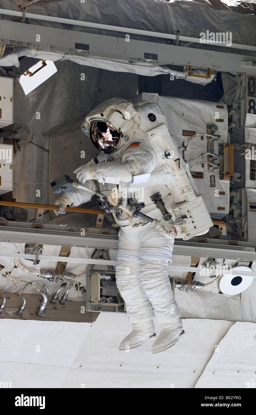 Astronaut participating in extravehicular activity Stock Photo - Alamy