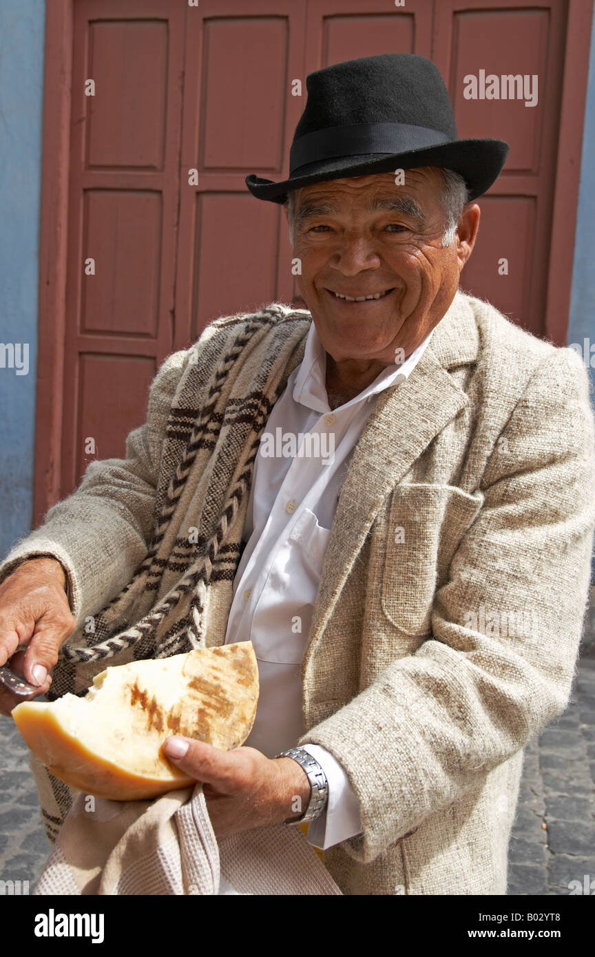 Man Handing Out Locally Made Cheese At Patron Saint Fiesta In Guia ...