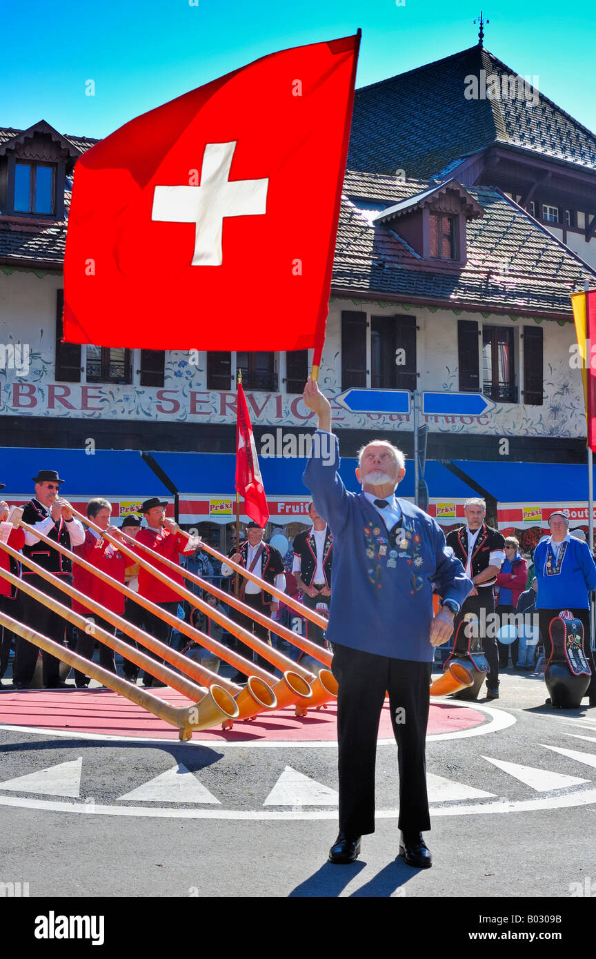 A Swiss flag-thrower performing in the town of St Cergue, at their ...