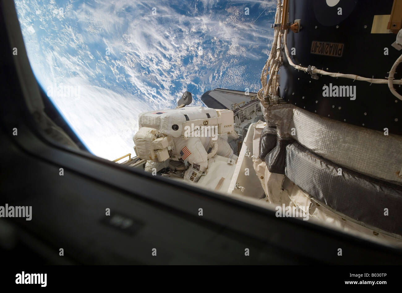 Astronaut participating in extravehicular activity Stock Photo - Alamy