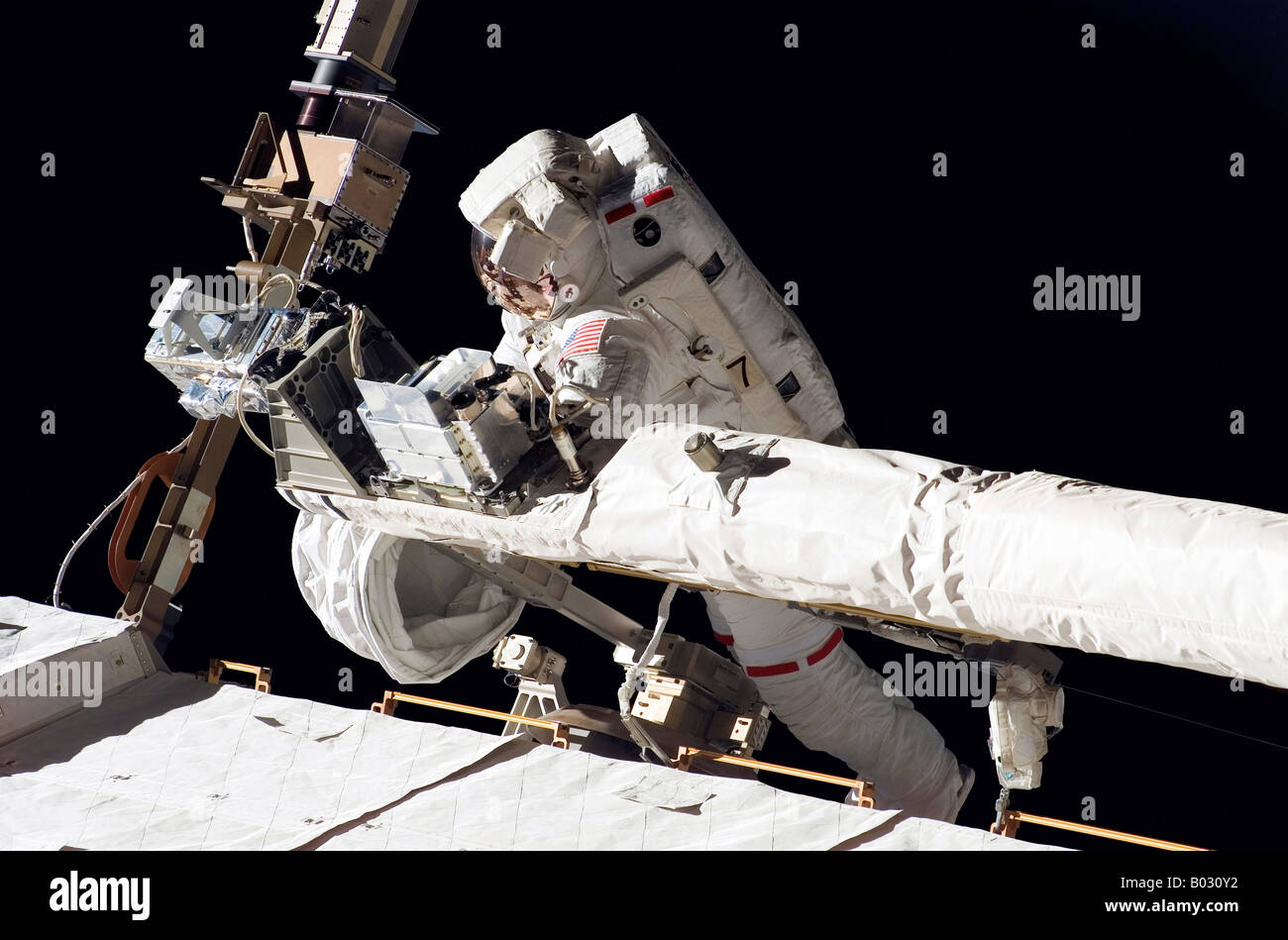 Astronaut participating in extravehicular activity Stock Photo - Alamy