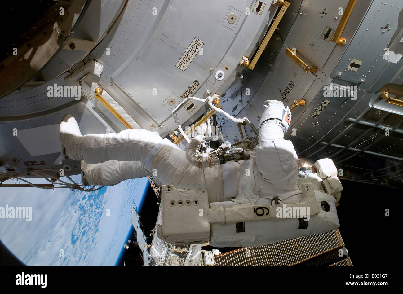 Astronaut participating in extravehicular activity Stock Photo - Alamy