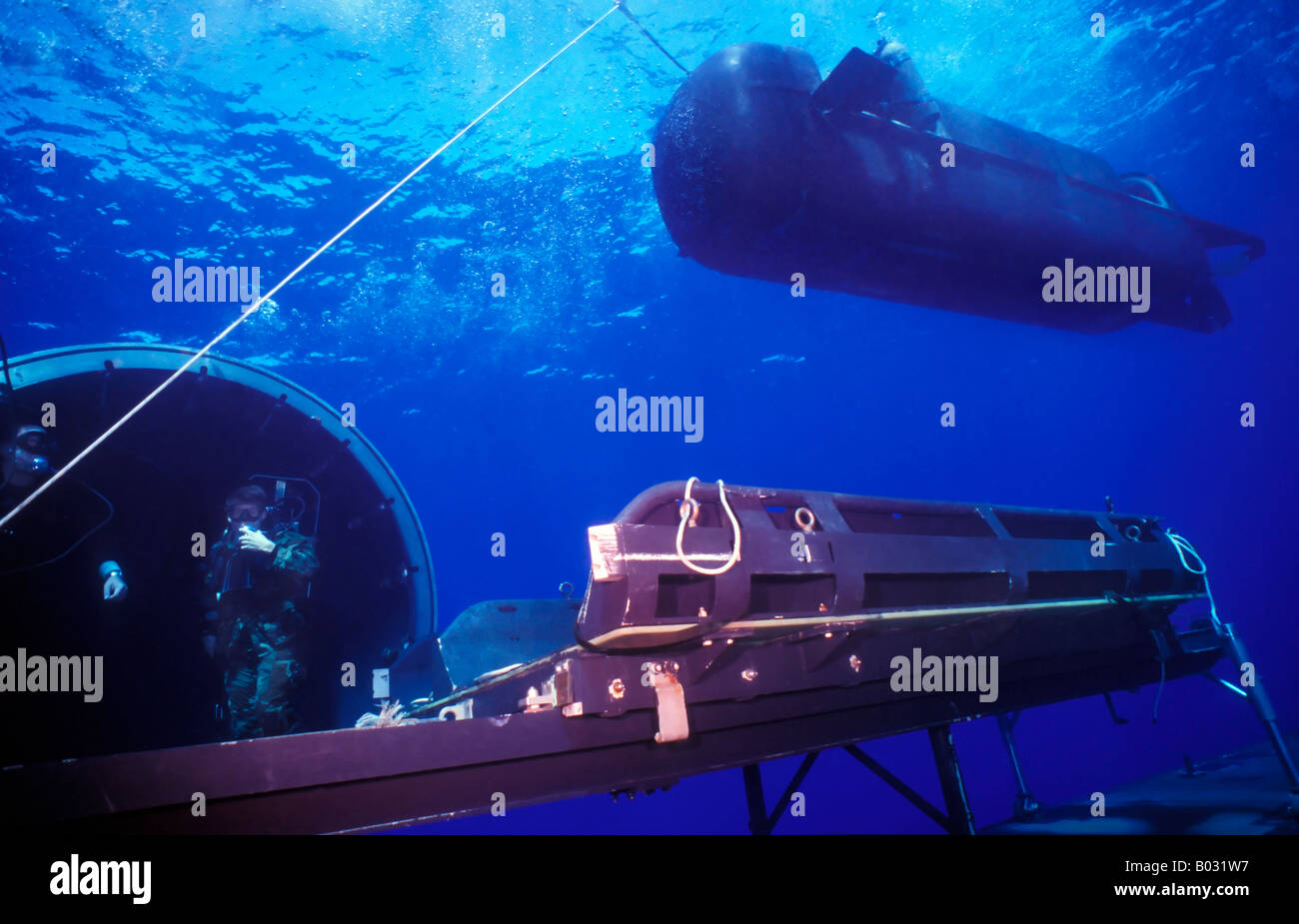 A SEAL Delivery Vehicle hovers above the Naval Special Warfare Dry Deck ...