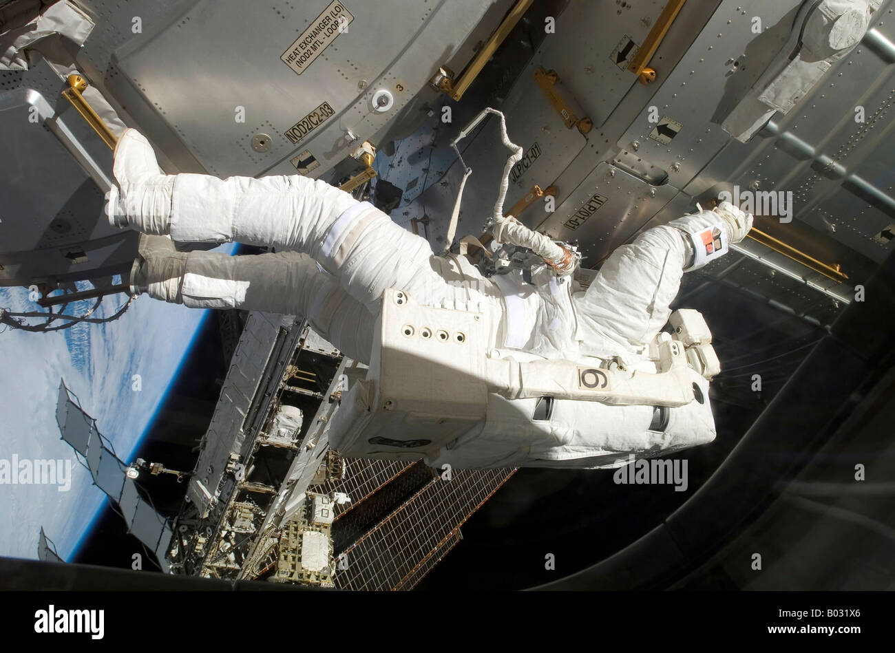 Astronaut participating in extravehicular activity Stock Photo - Alamy