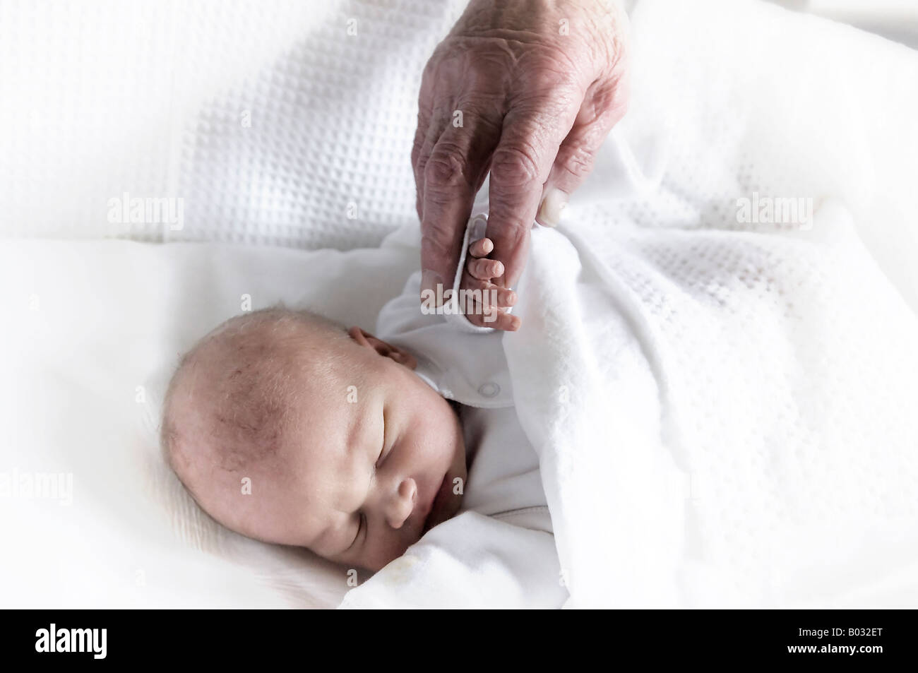 New Born With Old Hand Stock Photo - Alamy