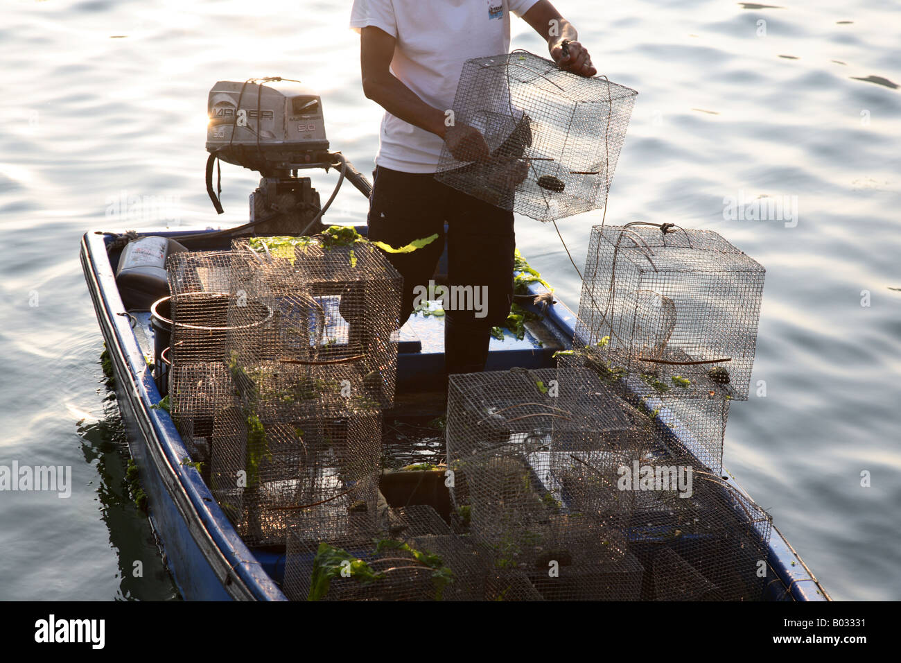 Chinese fisherman setting fish traps Sok Kwu Wan Lamma Island Hong Kong ...