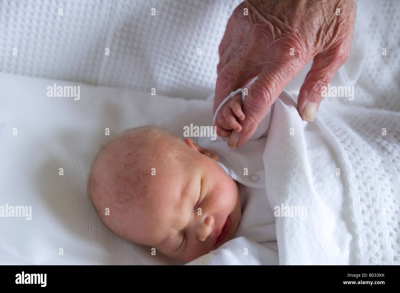 New Born With Old Hand Stock Photo - Alamy