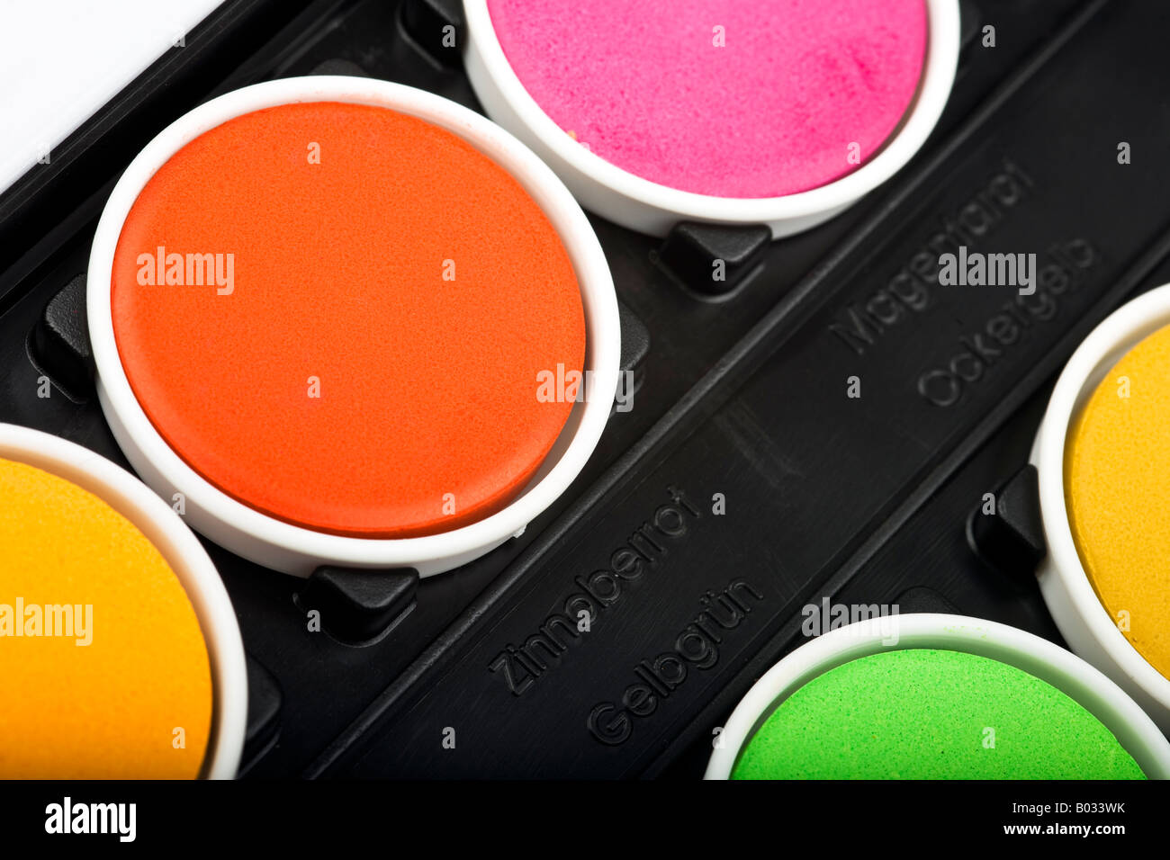Multicolored water color box on white background Stock Photo - Alamy