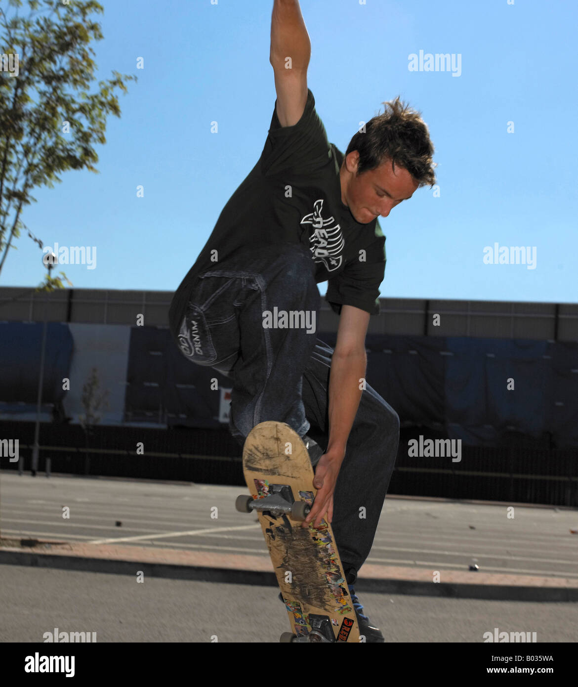 Skateboarder performing a jump Stock Photo - Alamy