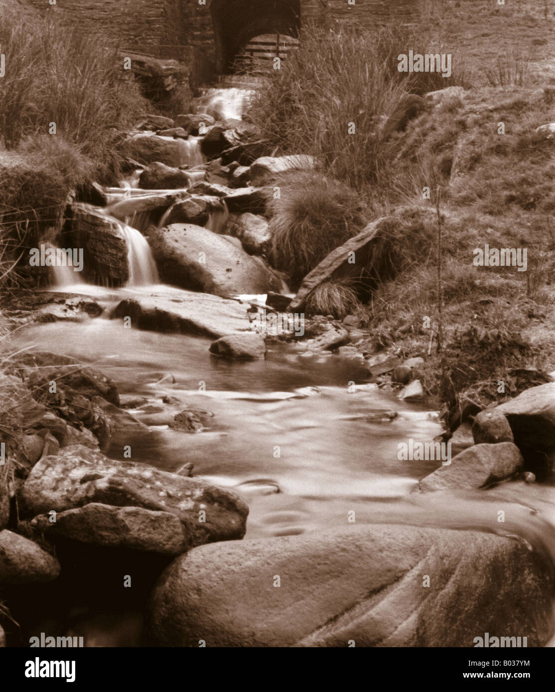 Brook flowing water rocks hi-res stock photography and images - Alamy