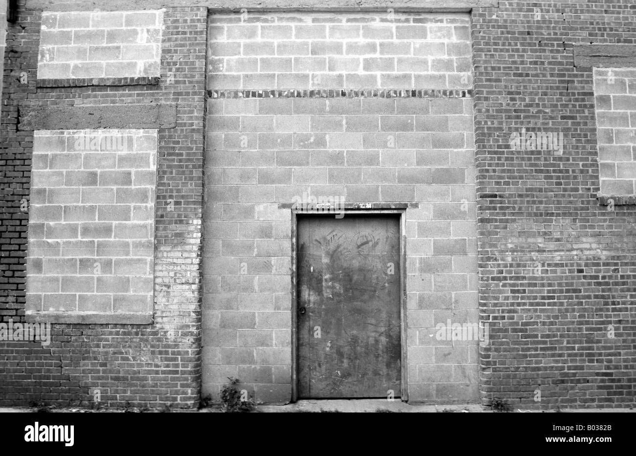 A door and brick wall in a back alley in Kearney, Nebraska, USA Stock ...