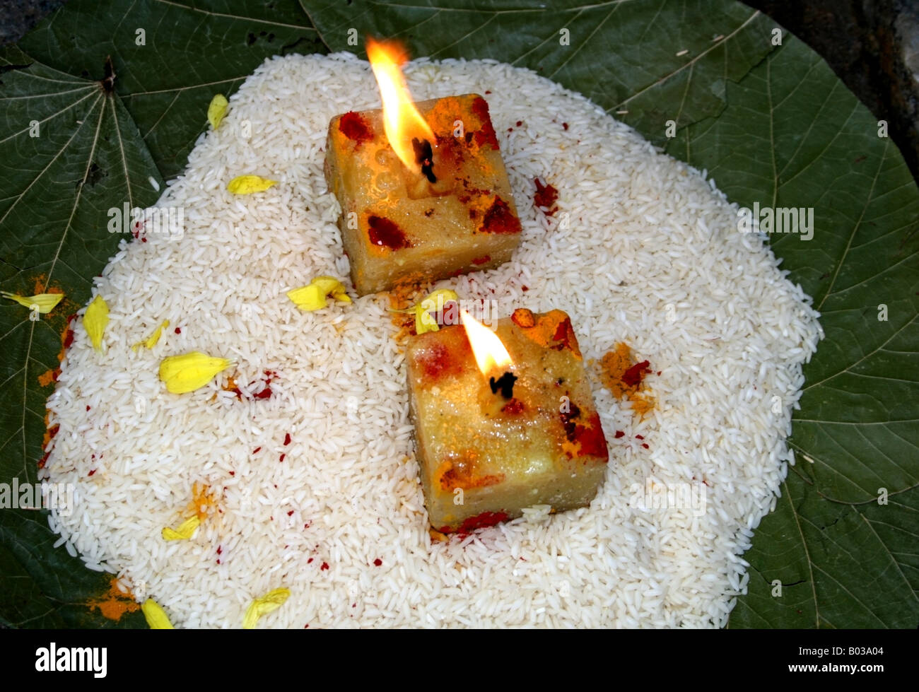 Hindu offering of arti and rice pooja at a temple in India Stock Photo ...