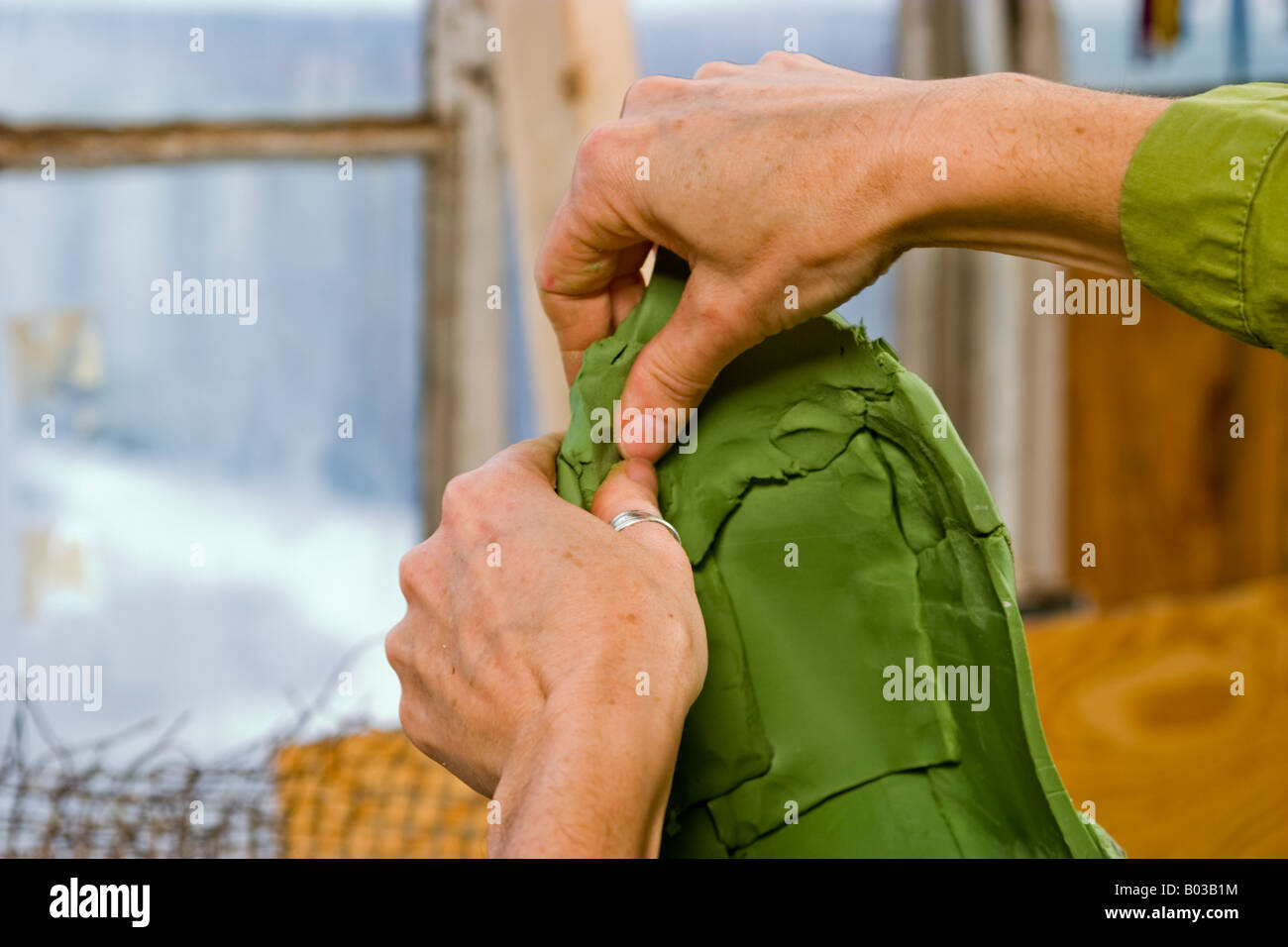 Close up of a woman artist s hands creating a clay sculpture MODEL ...