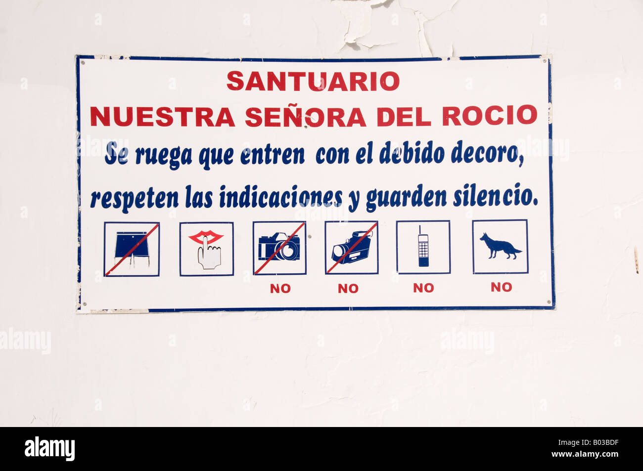 notice in church of El Rocio listing what is forbidden Stock Photo - Alamy