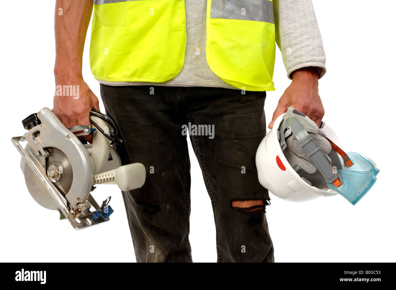 Man holding construction tools Stock Photo - Alamy