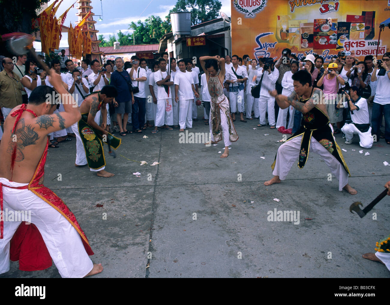 A morning ceremony where the local patrons cut themselves with axes and ...
