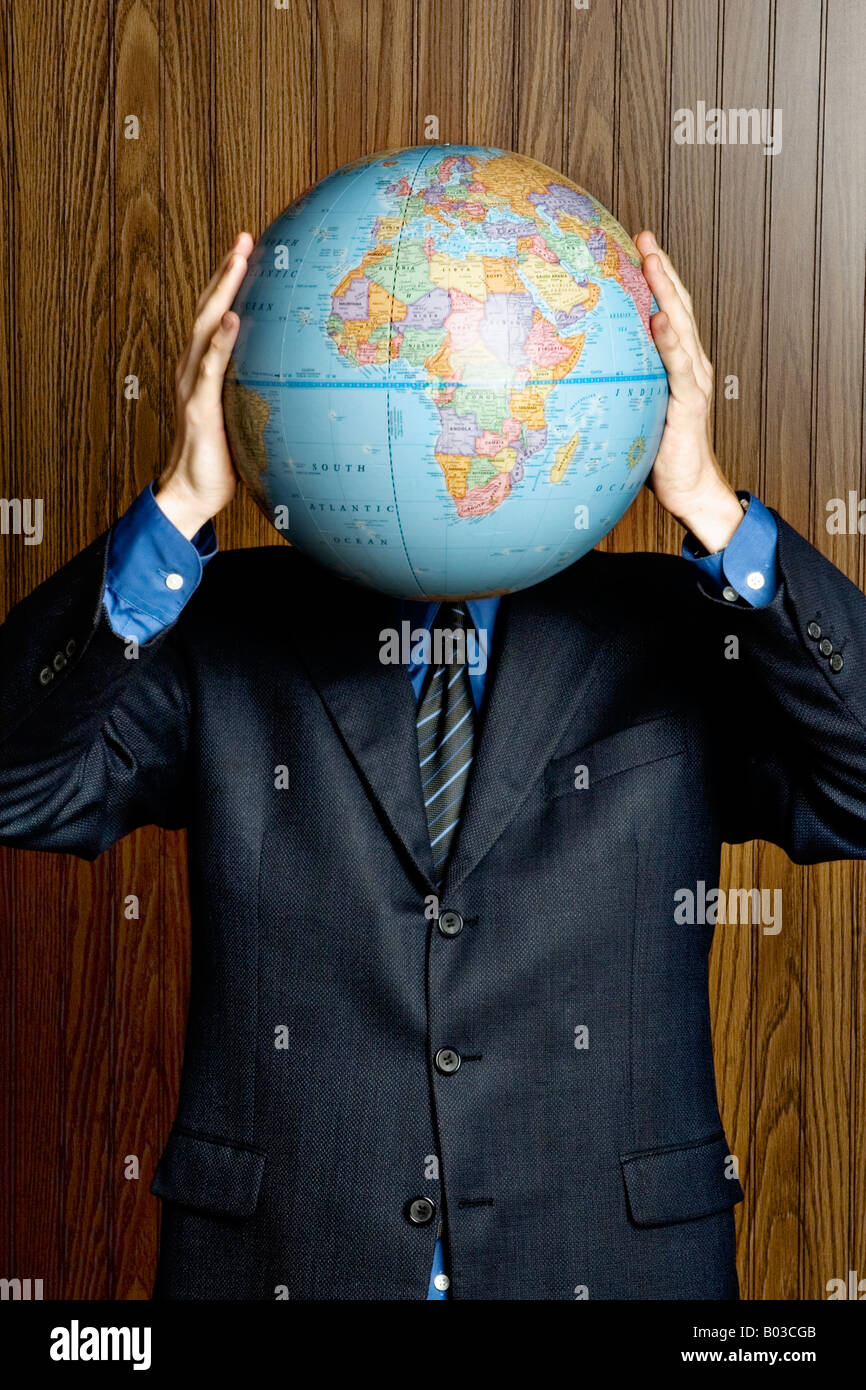 Man holding globe earth hi-res stock photography and images - Alamy