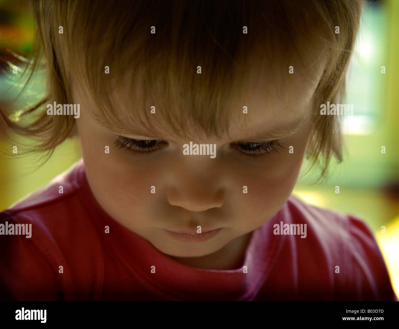 toddler female girl looking down contemplative thinking Stock Photo - Alamy