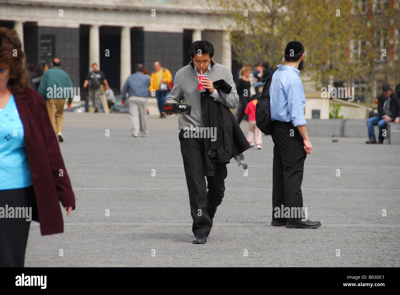 walking and eating Stock Photo - Alamy