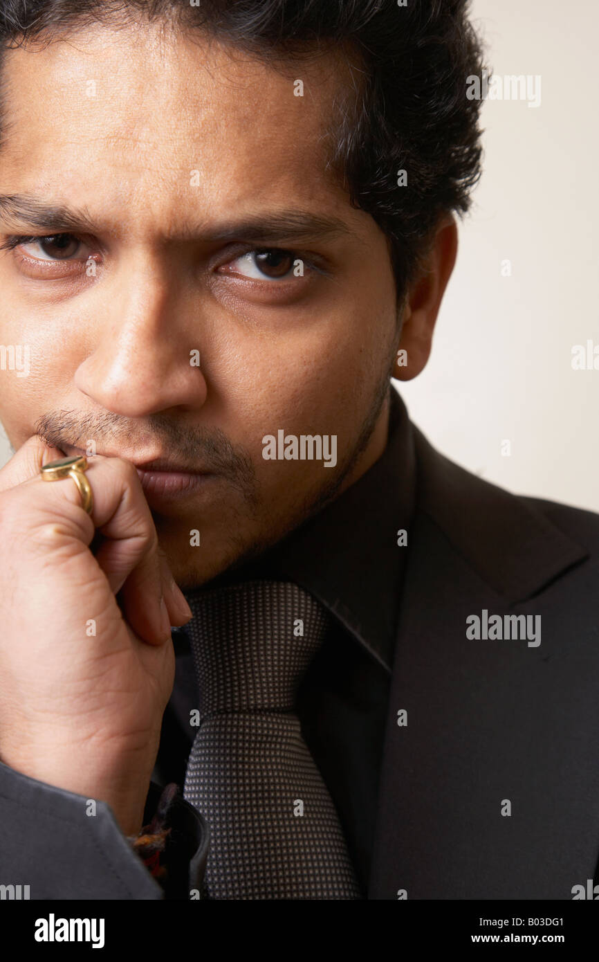 Indian businessman making face Stock Photo - Alamy