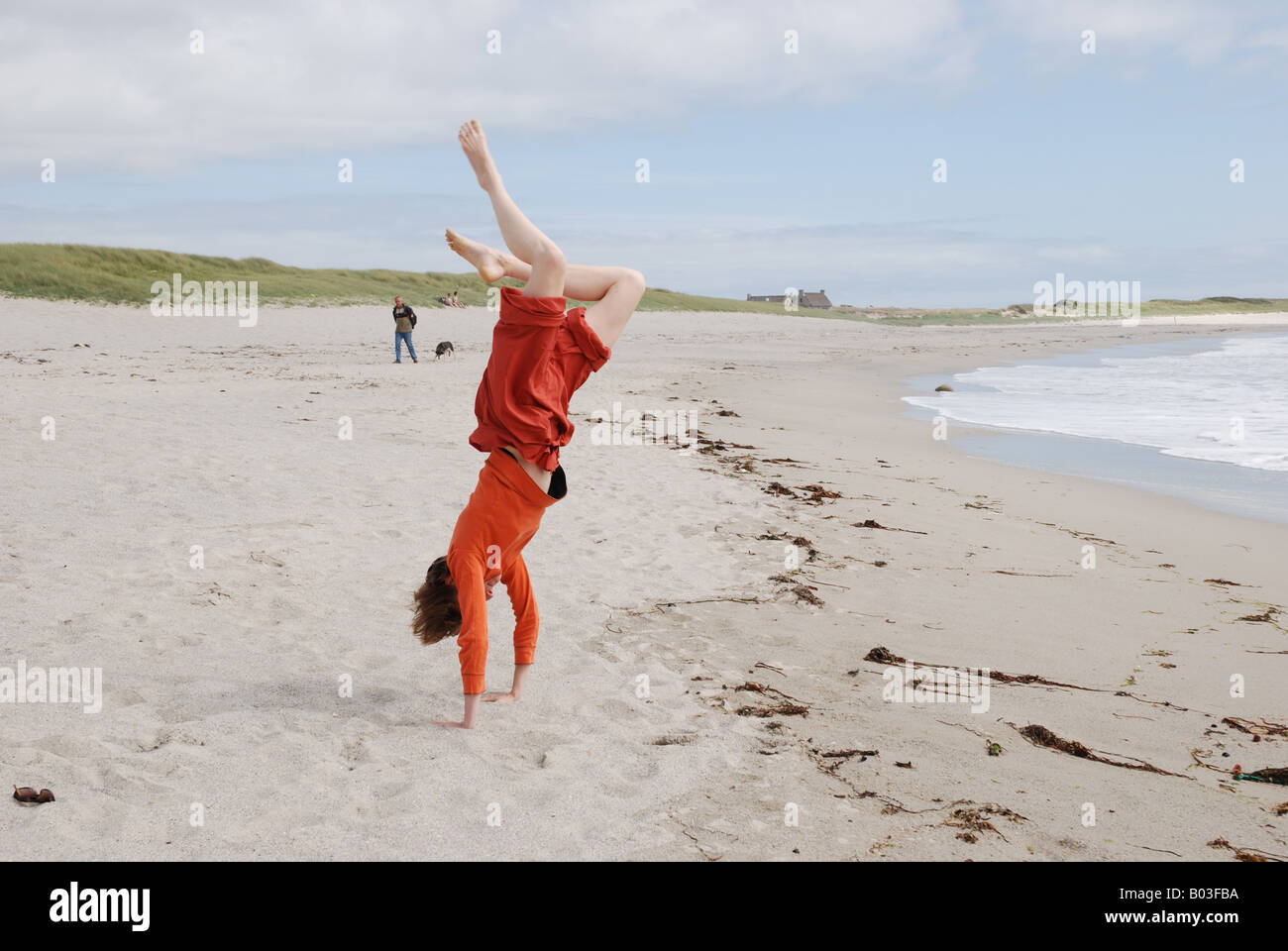 Woman headstand beach hi-res stock photography and images - Alamy