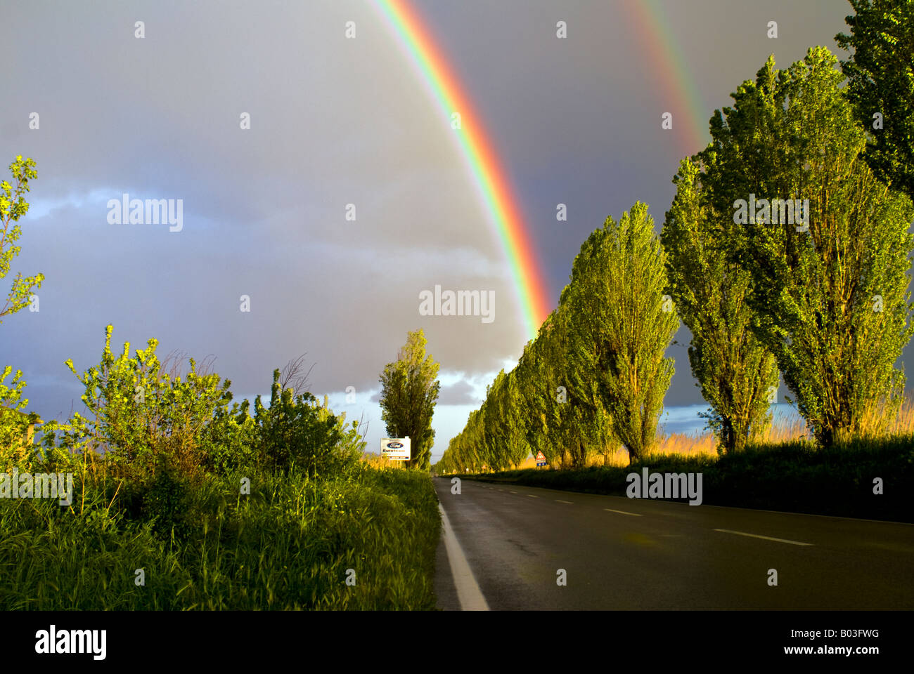 rainbow on the road Stock Photo - Alamy