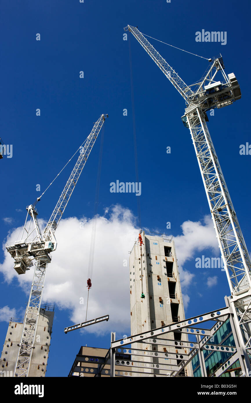 cranes on construction site Stock Photo - Alamy