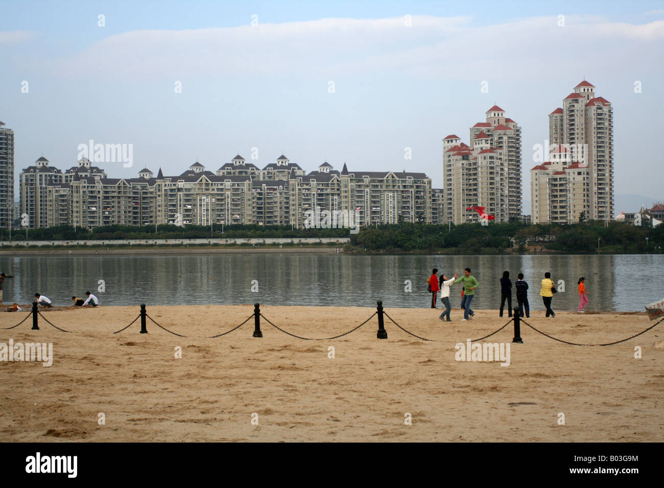 kids playing with kite on a beach in fuzhou, china Stock Photo - Alamy