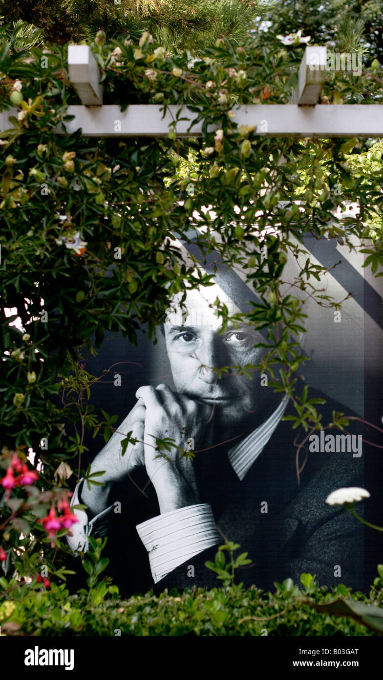 Monochrome portrait of Christian Dior in the gardens of his museum at ...
