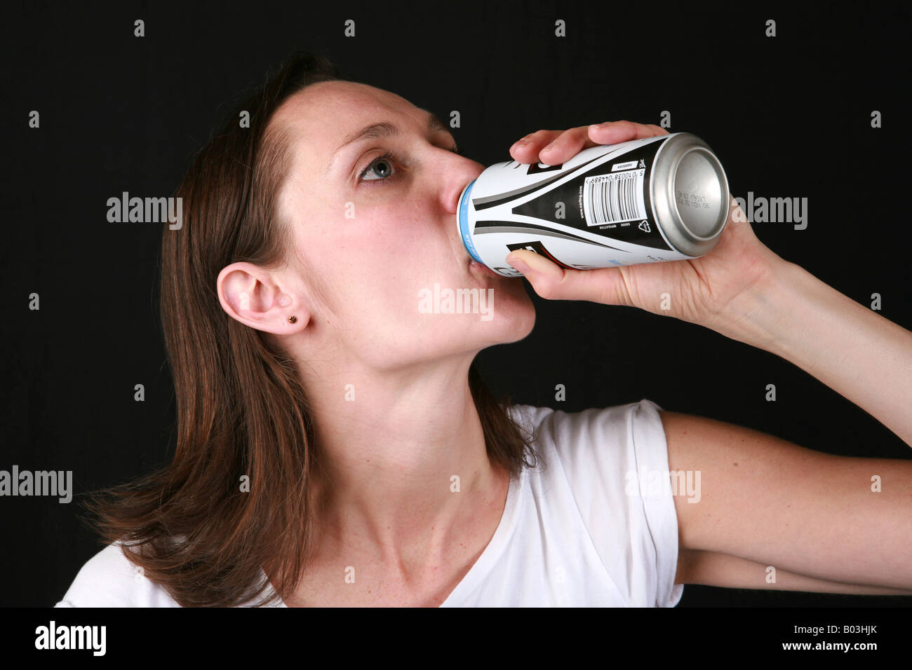 Young British woman drinking swigging cheap beer larger alcohol from ...