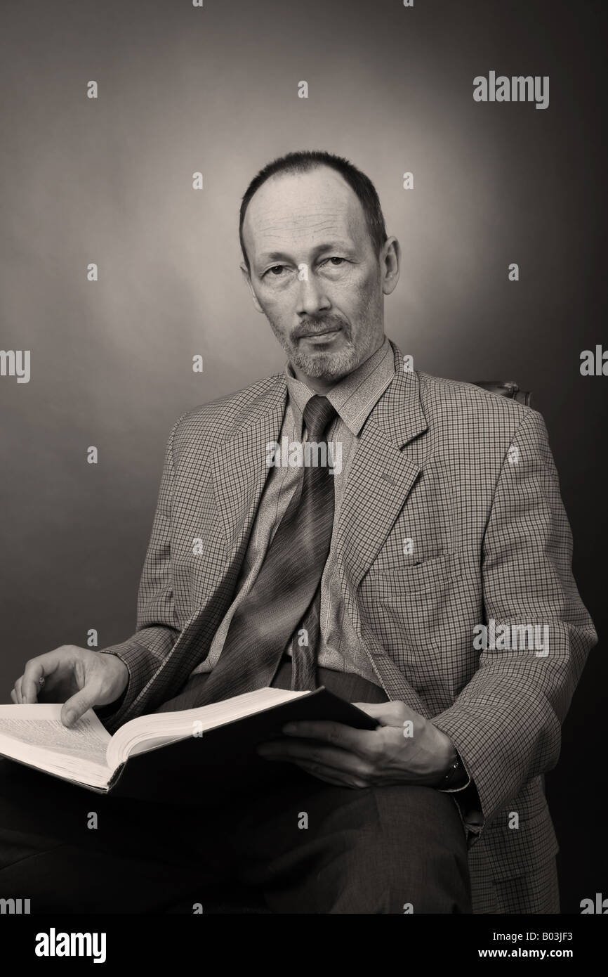 senior man with book black and white sepia Stock Photo - Alamy